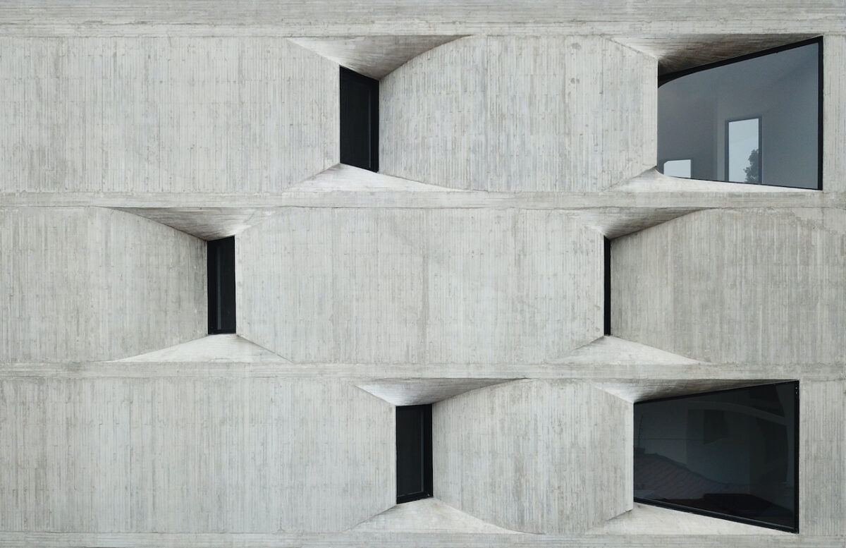 Mexico City concrete housing designed with undulating, irregular facade ...